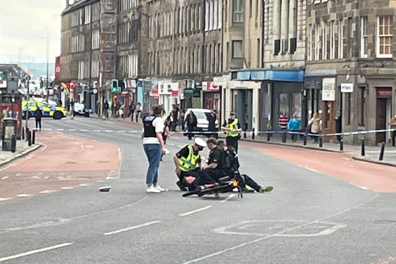 Edinburgh police 'take down' VOI cyclist inside cordon during ongoing ...
