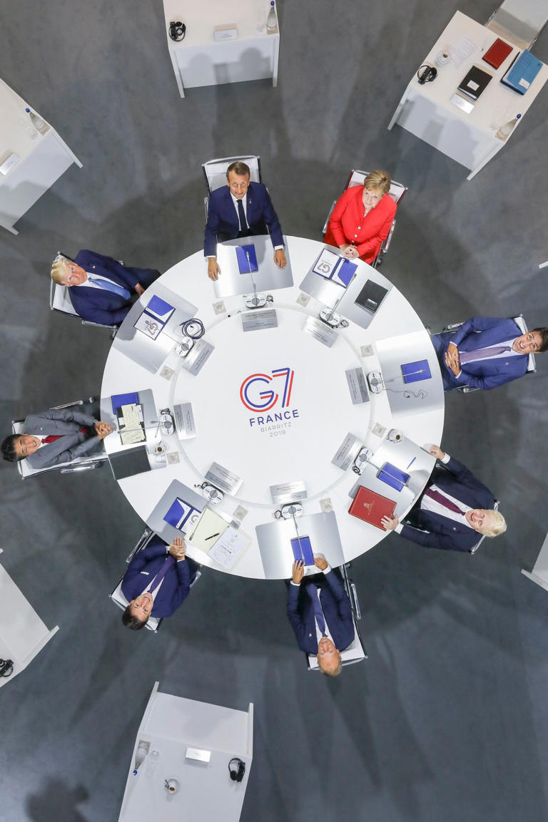 Trump looks awkward in bizarre aerial photo of grinning G7 leaders