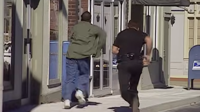 Police caught a bank robber in the act - he responded by throwing ...