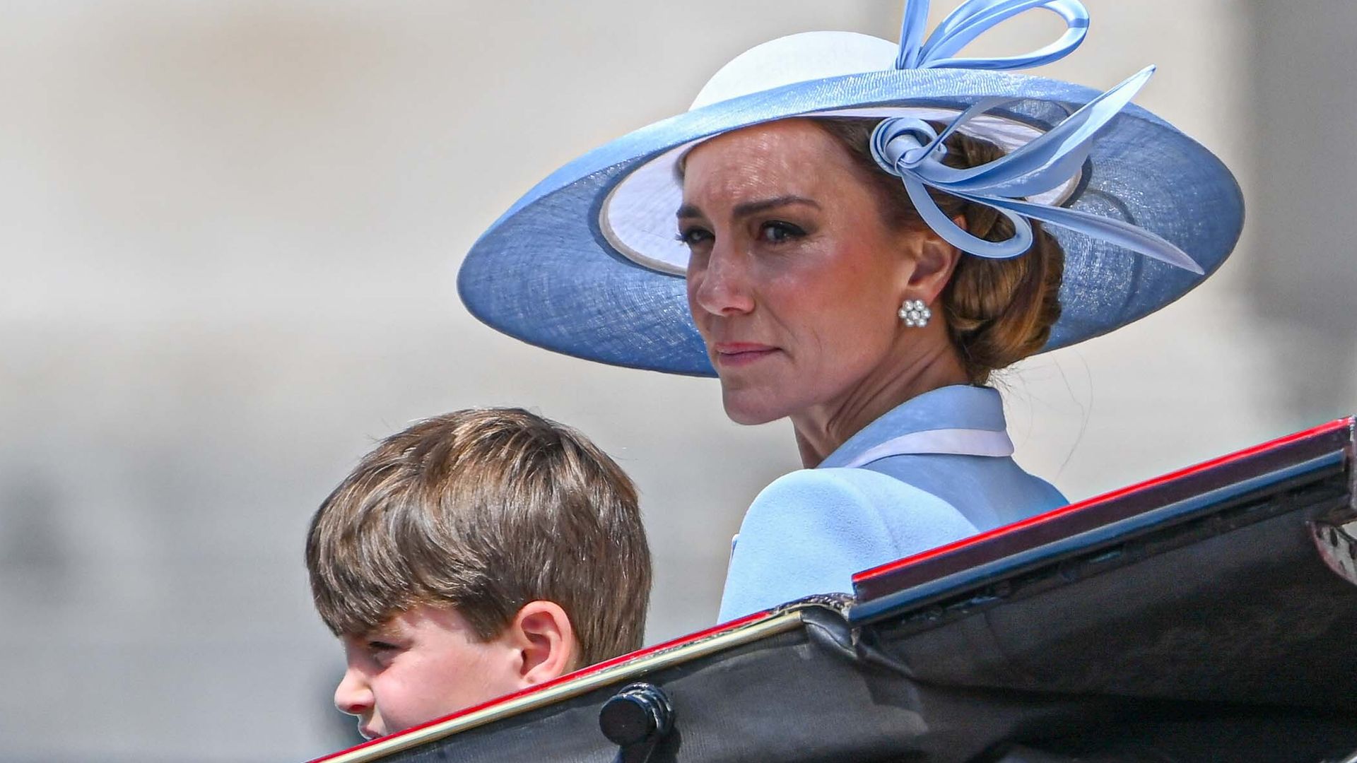 Kate Middleton reacts after anti-monarchy protesters boo her during ...
