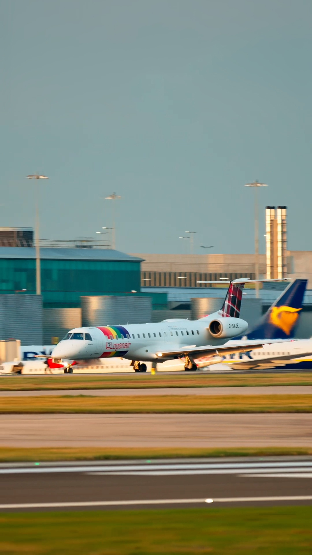 Loganair pride plane lands in golden hour