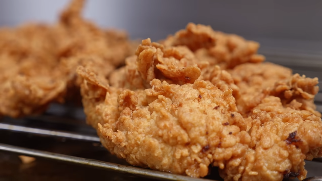 Watch how chefs create the ultimate fried chicken crunch