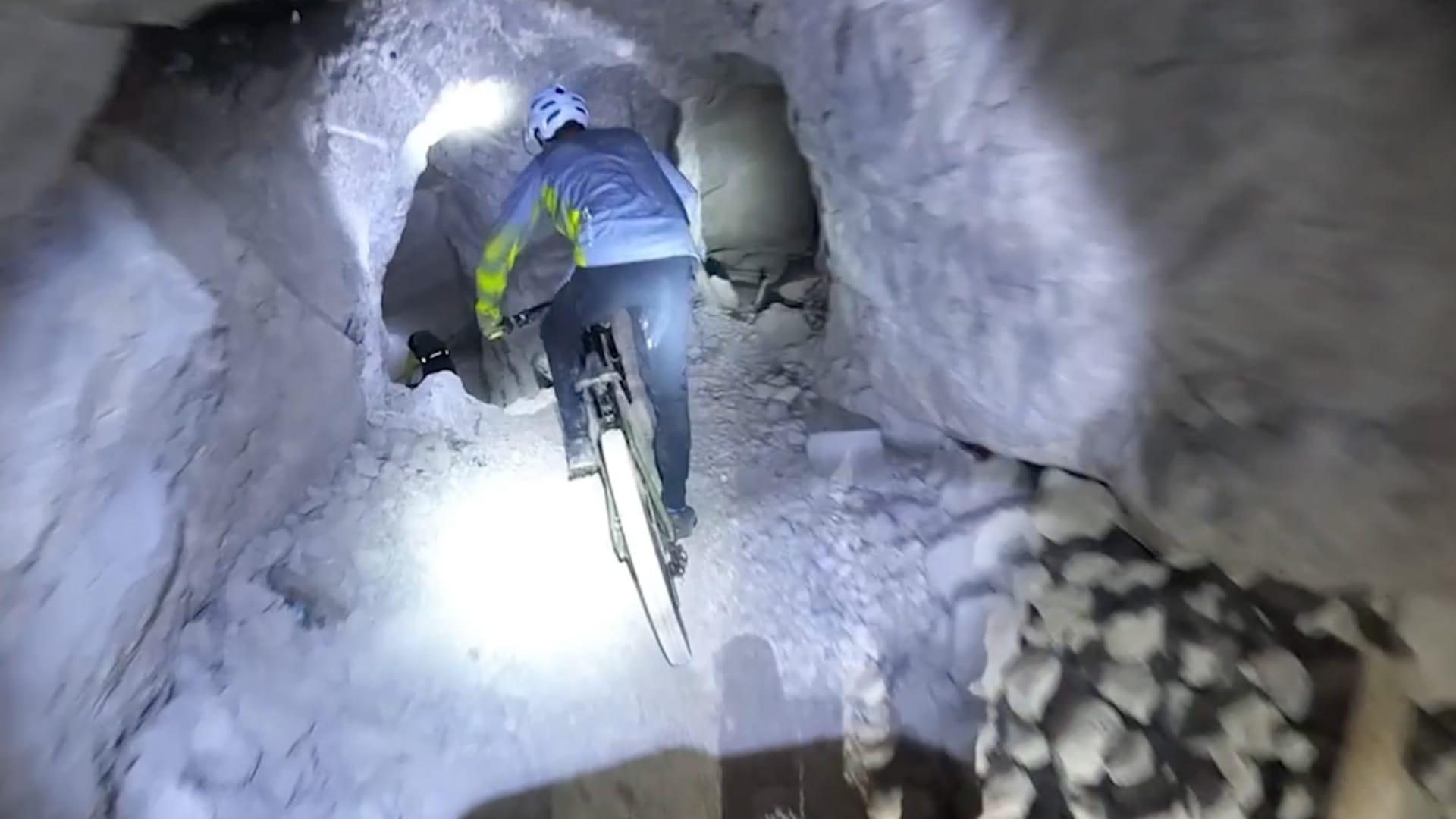 Cyclist rides nail-biting trail through 10km of tunnels in an abandoned ...