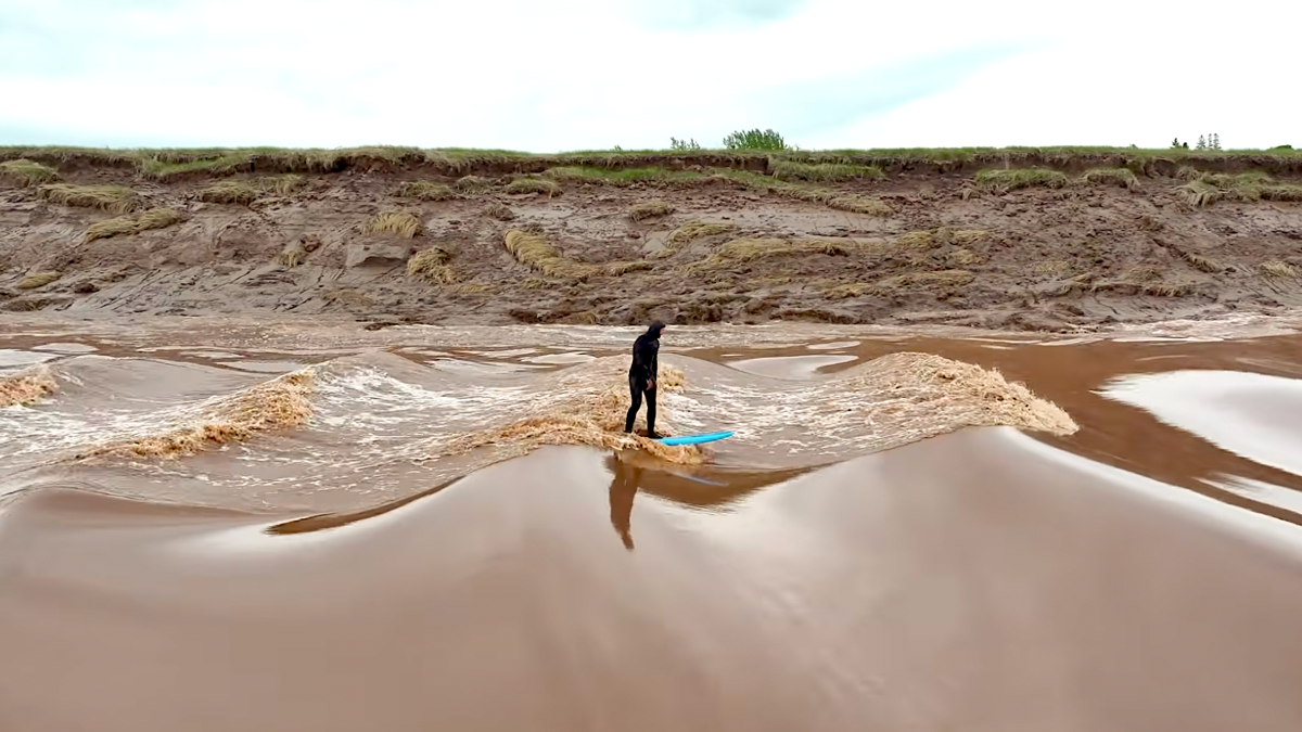 Ben Gravy rides 20-foot tidal surge on Canada’s wildest river bore (video)