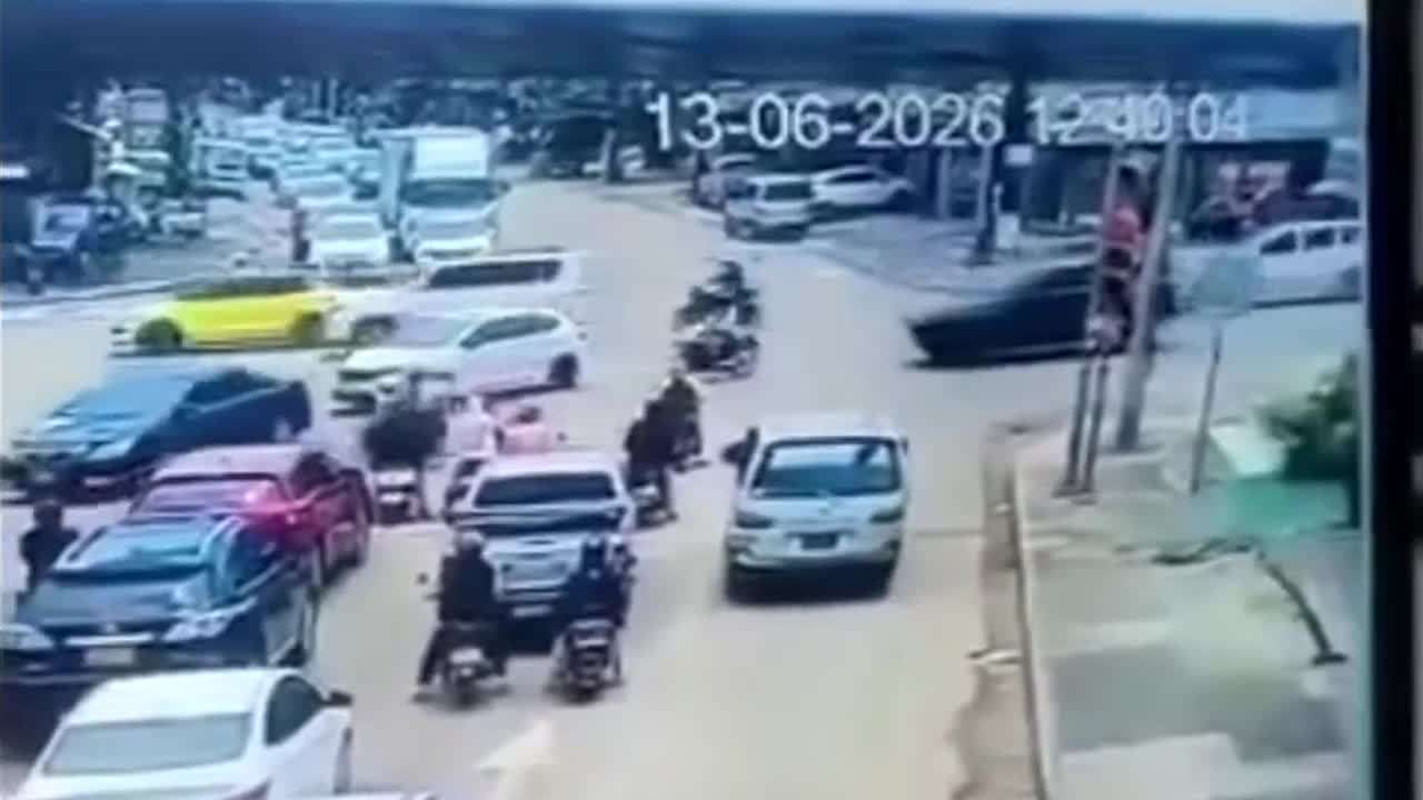 SUV crashes into vehicles before hitting traffic light control box in Laos