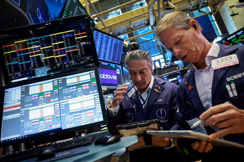 NASDAQ, S&P 500 slip while Dow hits record high