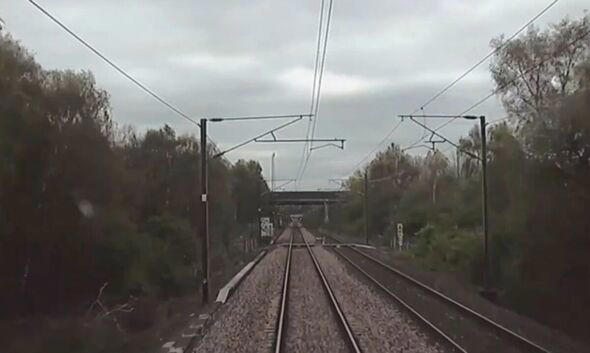 Watch as man cheats death while jogging in front of train travelling ...