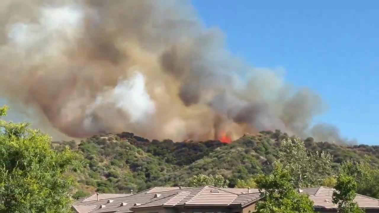 Fire burns on hillside in Stevenson Ranch, California