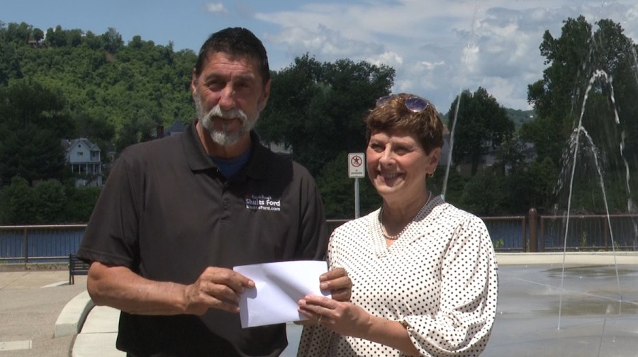 Wheeling Rotary presents Ohio County fair with check for a movie night