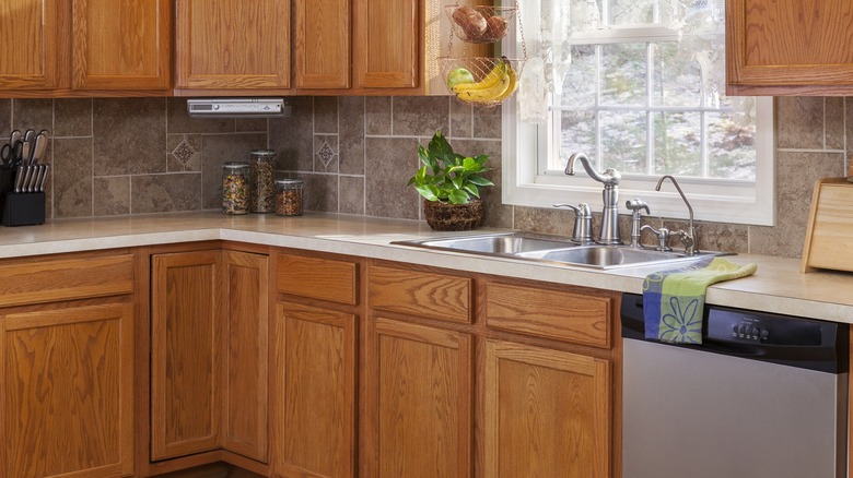 Forget expensive upgrades: Give dated honey oak cabinets a modern look