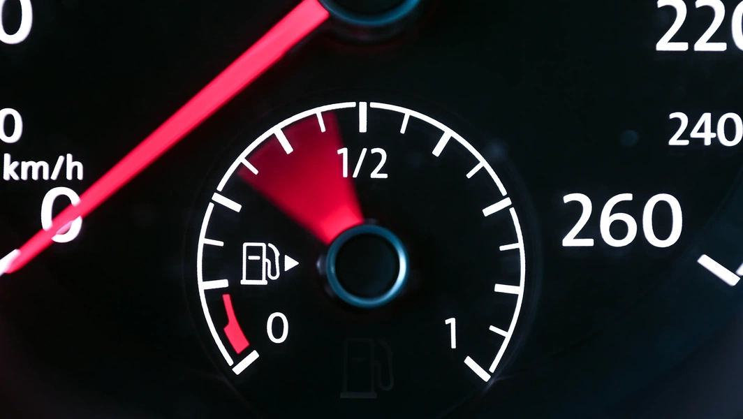 The origin and impact of the fuel gauge arrow