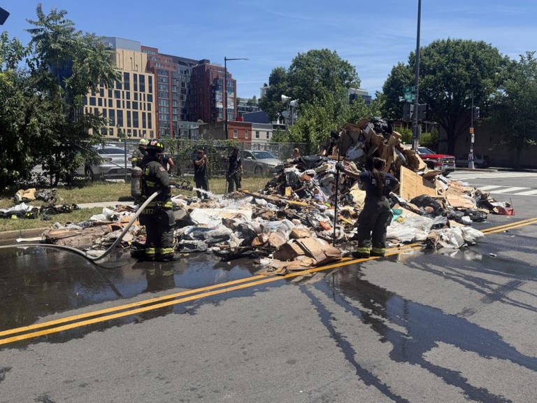 Trash truck load catches fire in Southwest DC