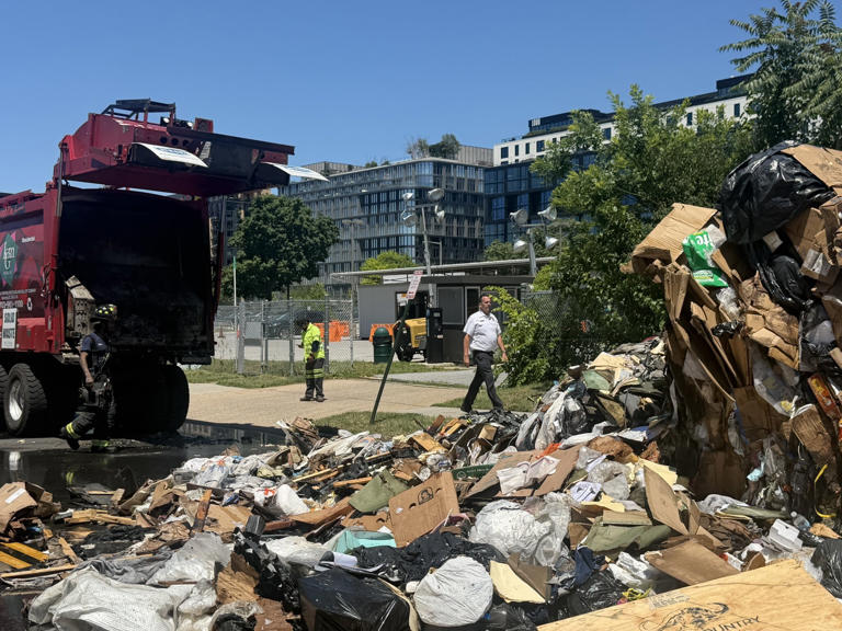 Trash truck load catches fire in Southwest DC