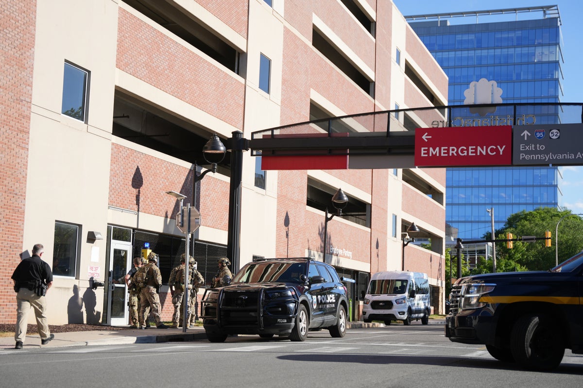 Police launch manhunt after hospital worker shot dead
