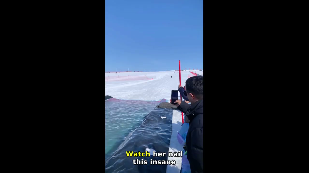 Woman nails water crossing on snowboard in Gansu
