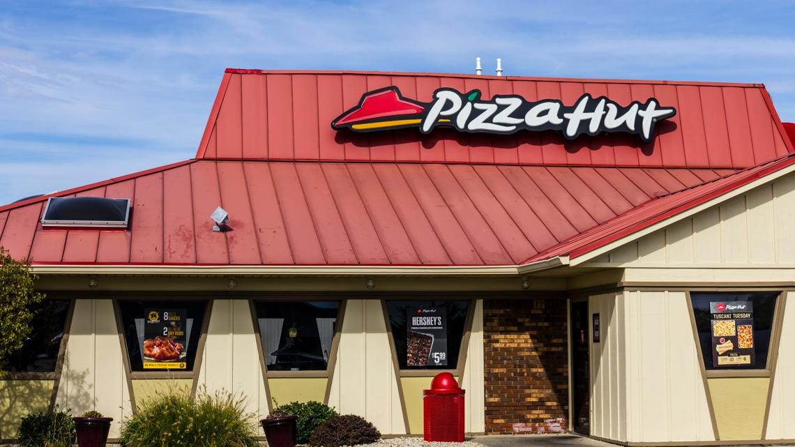 Pizza Hut got sold, and the retro red roofs are caught in the middle