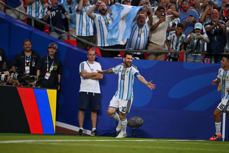 Photos: Messi scores his first World Cup hat trick vs. Algeria in ...