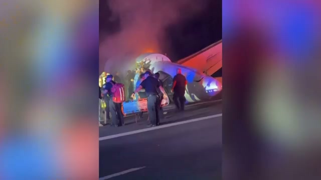 Plane passengers pulled from fiery wreckage after crash on highway