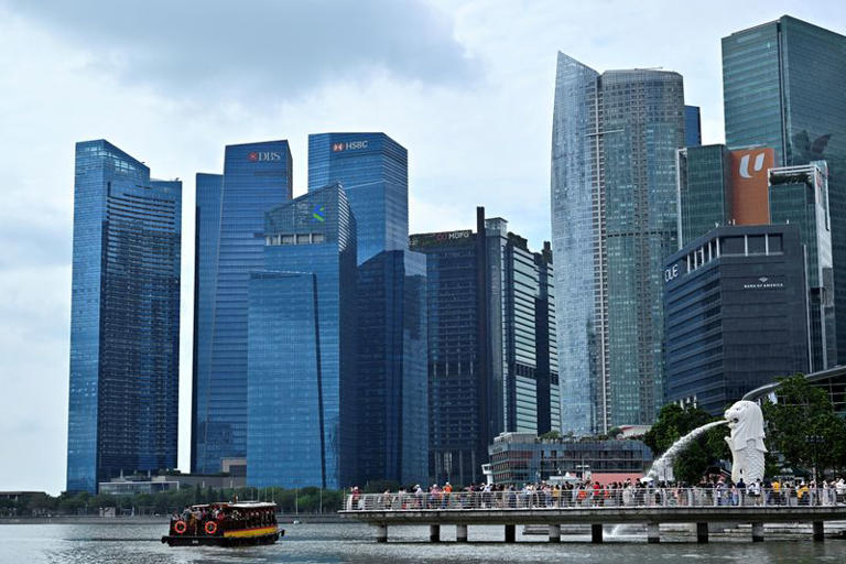 Economists cut Singapore 2026 growth forecast, expect policy hold in ...