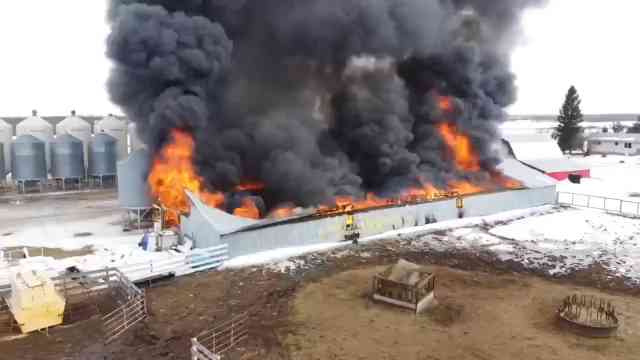 Drone captures footage of collapsed burning barn