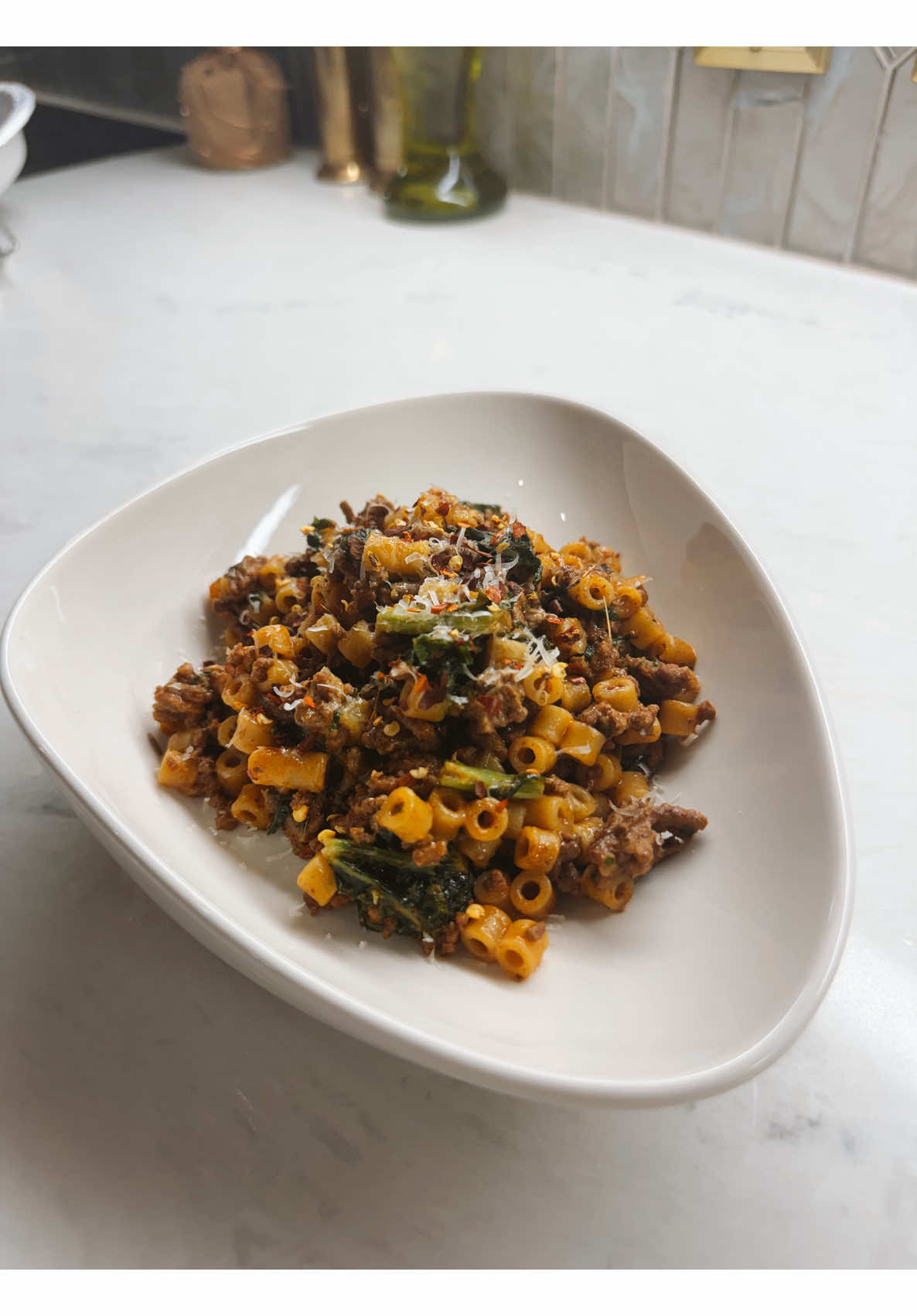 A hearty ditalini pasta with ground beef, leafy greens, and a sprinkle ...
