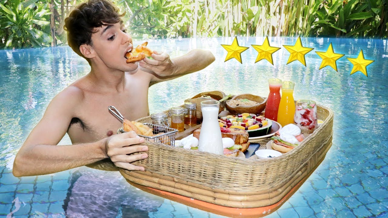 Eating a luxury five star hotel floating breakfast inside a pool
