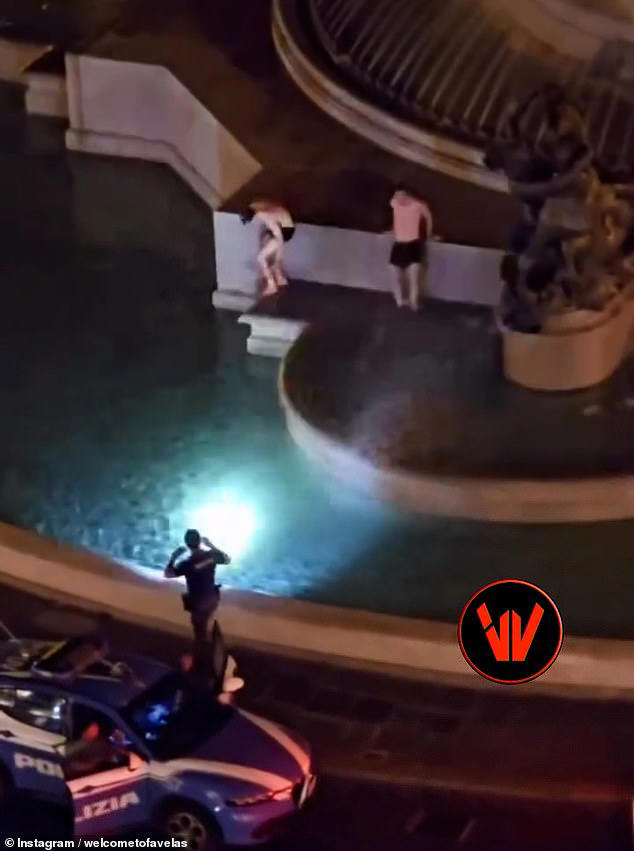Two men climb into Rome's ancient Fountain of the Naiads before hotel ...