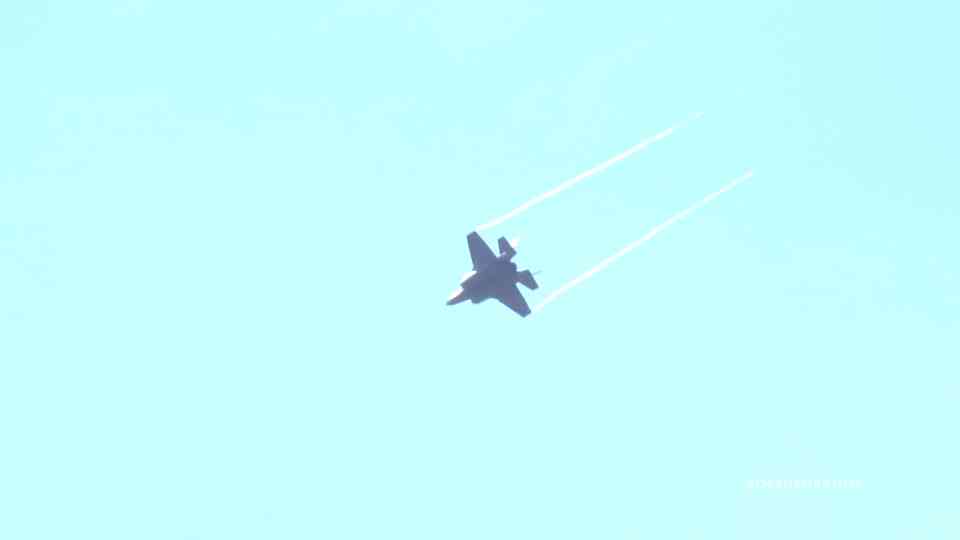 Watch the big wing roll in - then two warbirds tear across the crowd