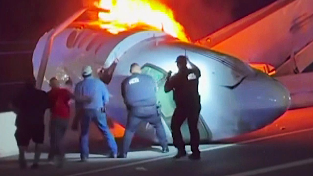 Private jet crashes onto Texas highway and bursts into flames, killing one