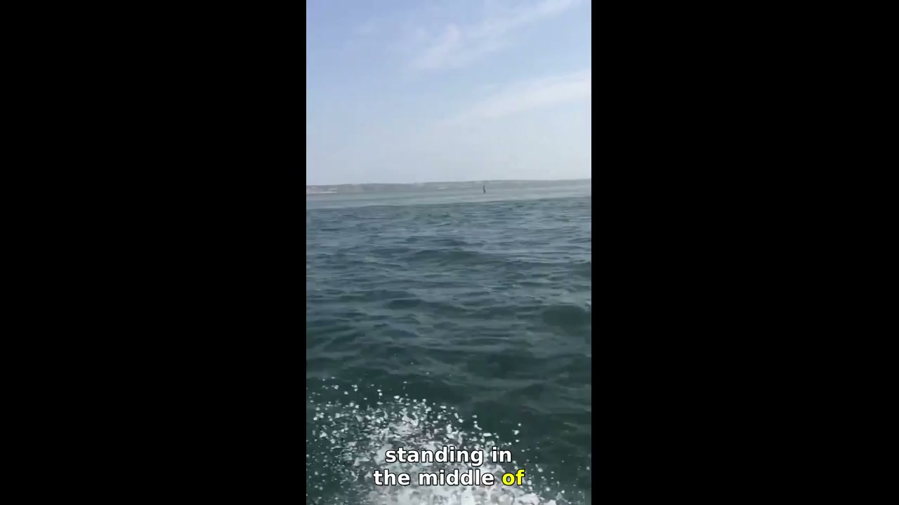 Man mysteriously standing in the middle of the sea in Angola