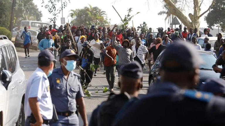 Look | Police clash with thousands of Malawian nationals camping at ...