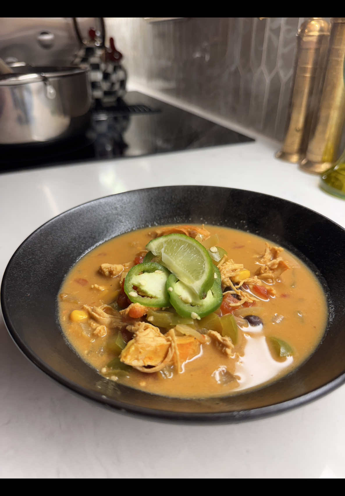 A cozy creamy chicken chili soup with corn, black beans, lime, and ...