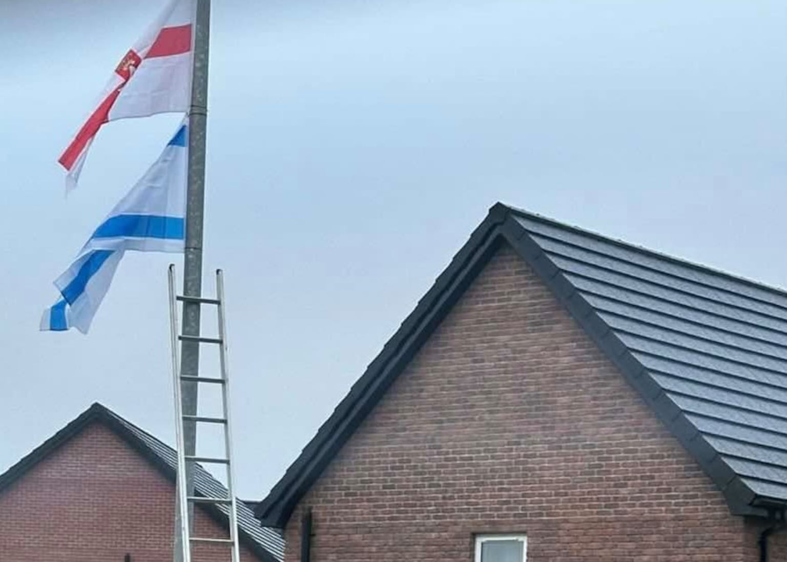 Flags put up at mixed, new-build estate 'attempt to mark territory and ...