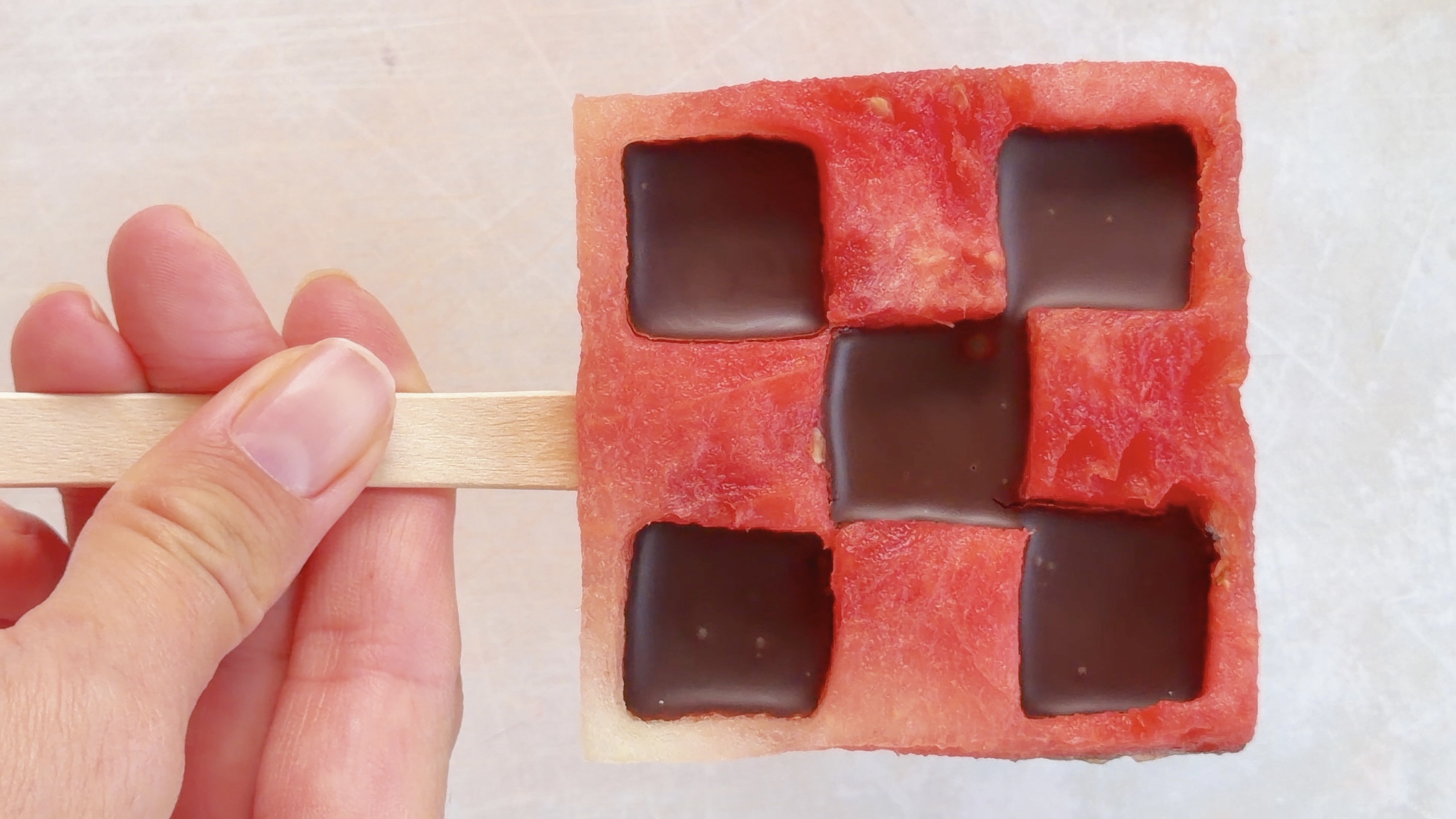 Checkerboard watermelon pops with dark chocolate