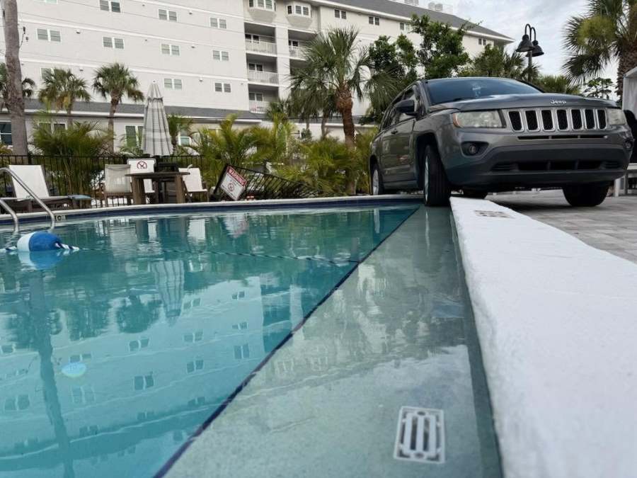 Close call: Jeep veers off road, ends up on edge of Clearwater pool
