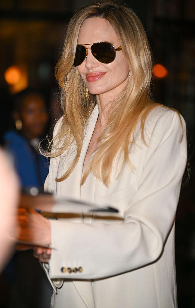 Angelina Jolie is timeless in a plunging black gown and her favorite ...