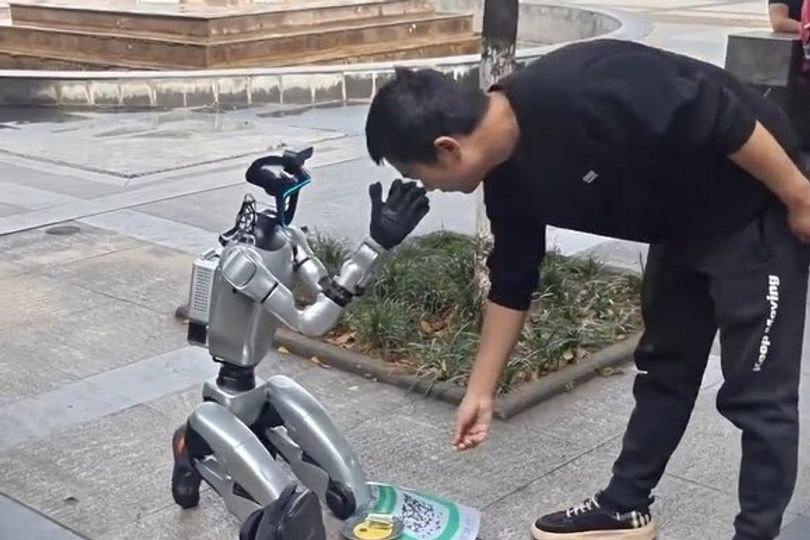 Robot spotted begging for cash on its knees in street after hitting ...