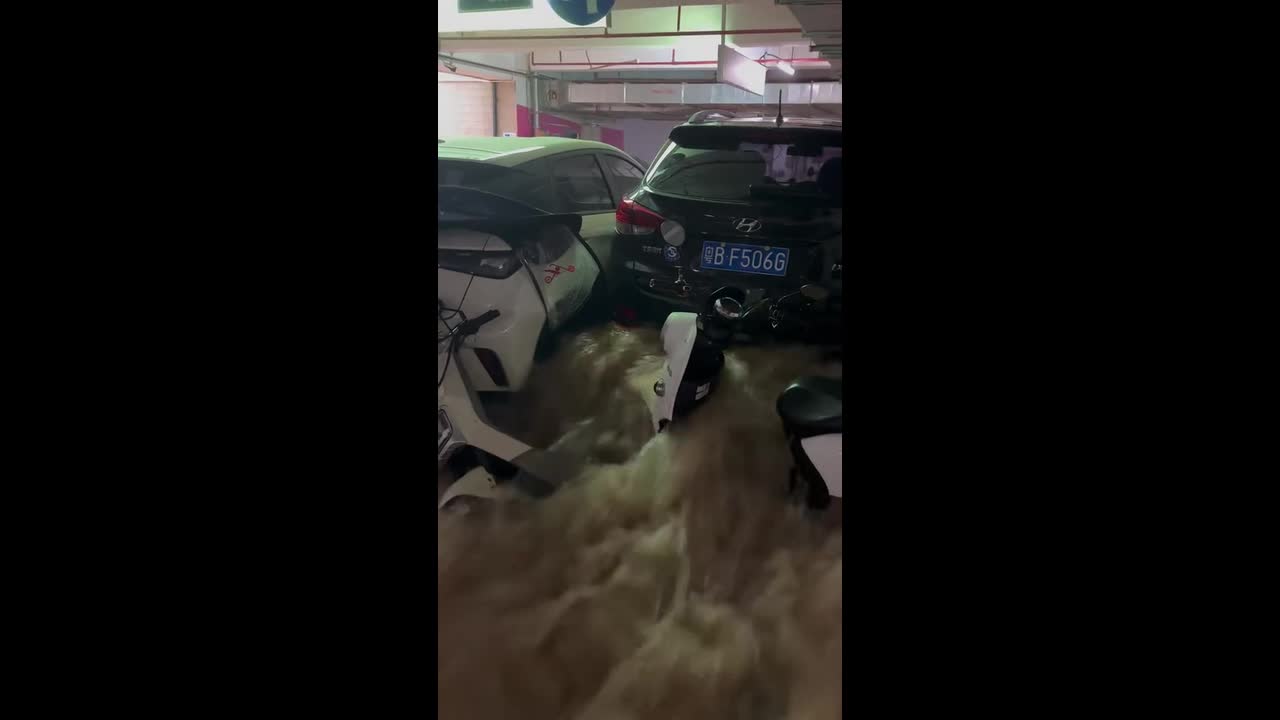 Torrential rain floods underground parking garage in Guangdong, China