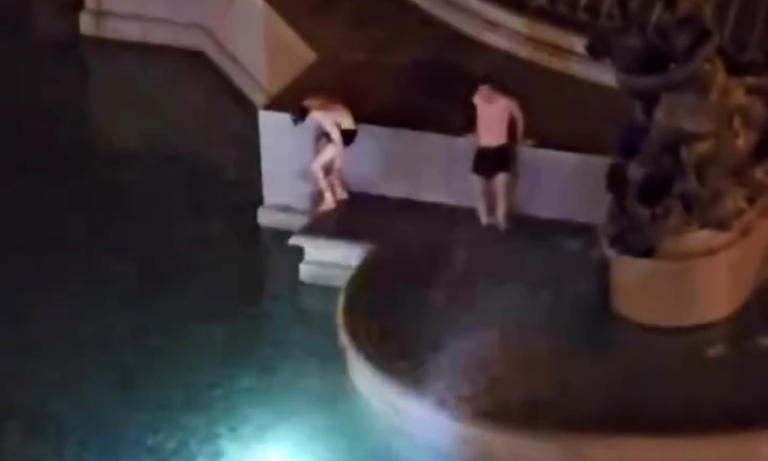 Two men climb into Rome's ancient Fountain of the Naiads before hotel ...