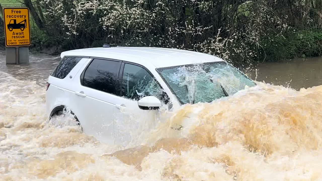 He hit the flood at full speed - seconds later his SUV was ruined