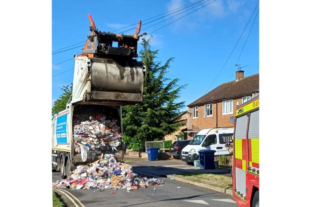 Rubbish dumped across street after bin lorry caught fire
