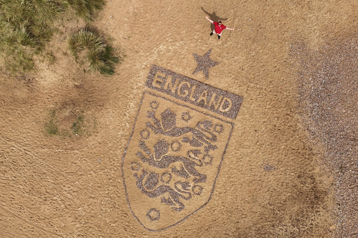 Artist creates 30-foot England badge on beach ahead of World Cup clash