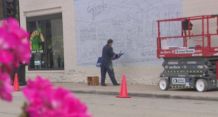 Local artist brings color and joy to Neenah with new mural