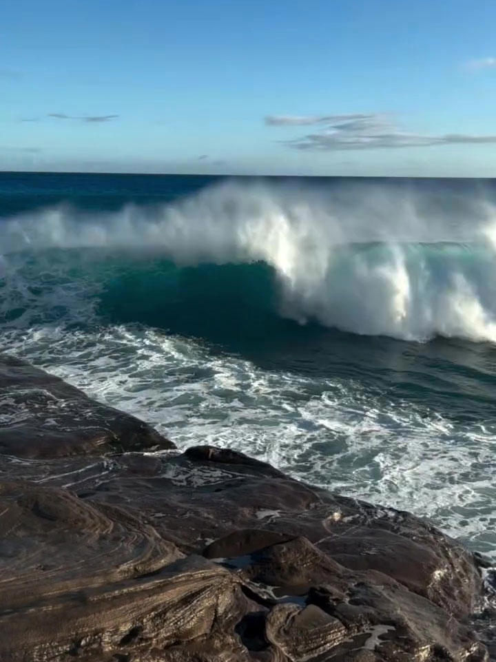 Rogue wave sweeps woman off infamous beach as frantic rescue caught on ...