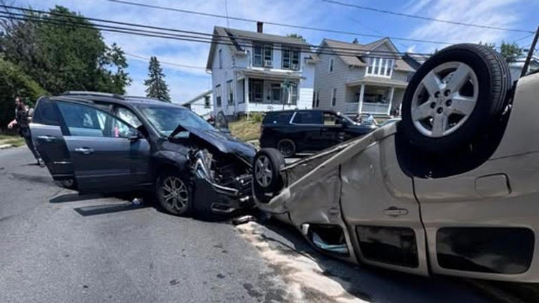 8 injured after vehicle flips over in crash