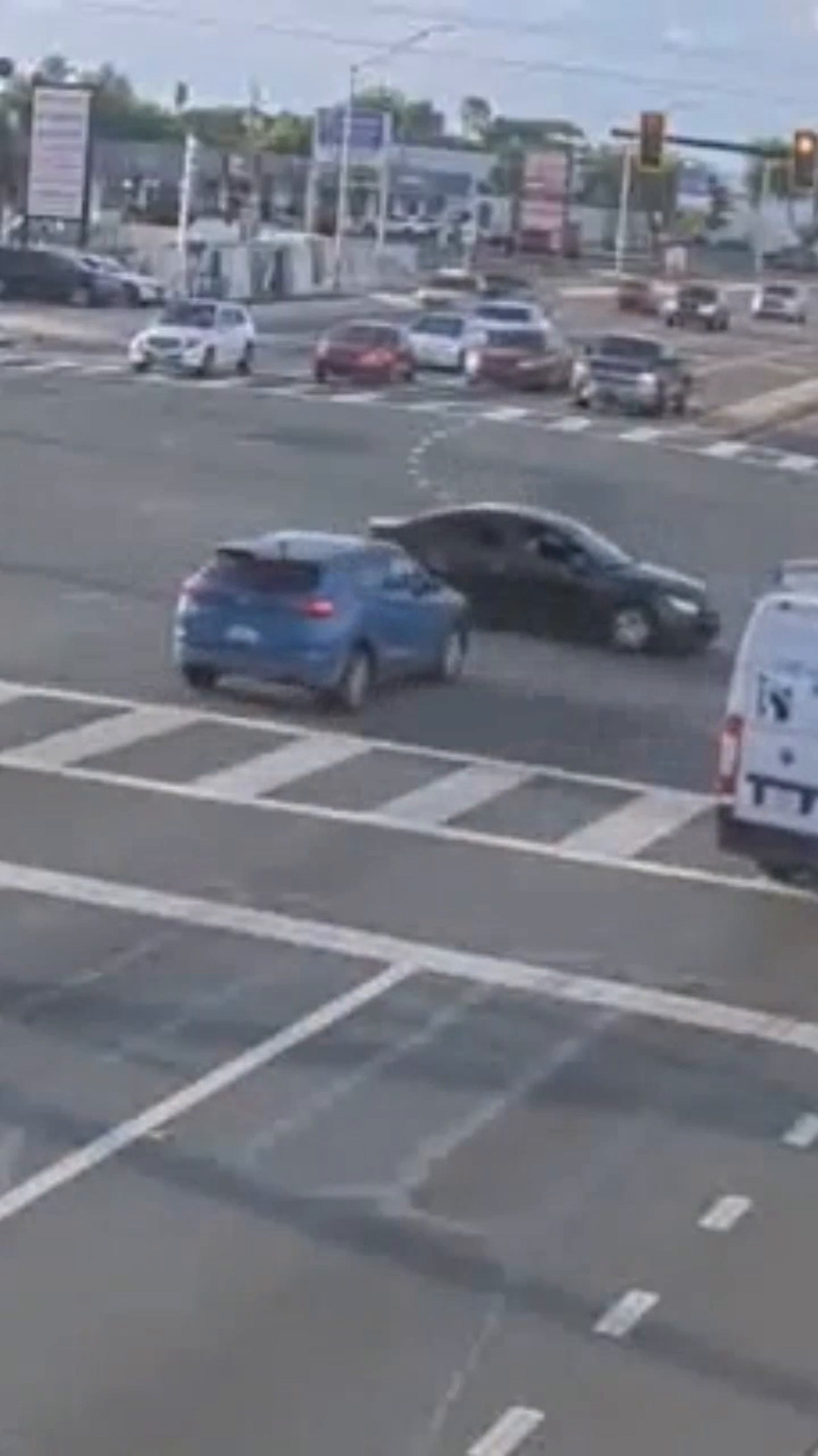 Red light runner misses car by inches