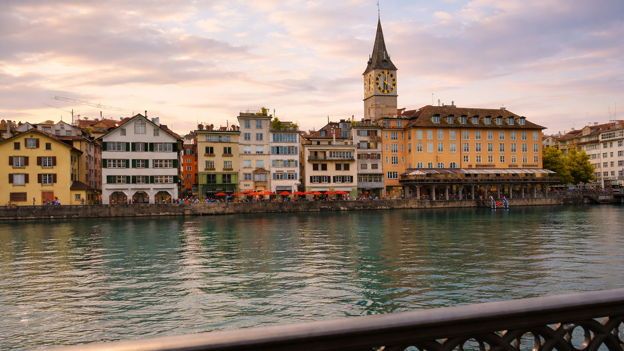 Zurich riverside walk with clock tower and evening reflections