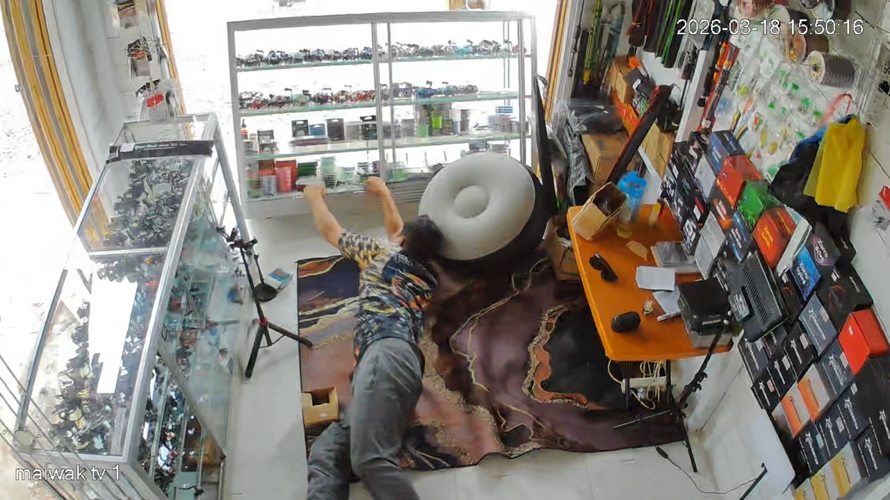 Oops! Man breaks glass display while trying to lie down