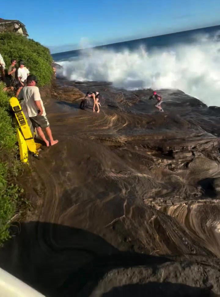 Rogue wave sweeps woman off infamous beach as frantic rescue caught on ...