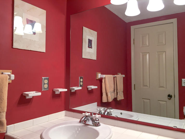 DIY mirror frame for a builder-grade bathroom